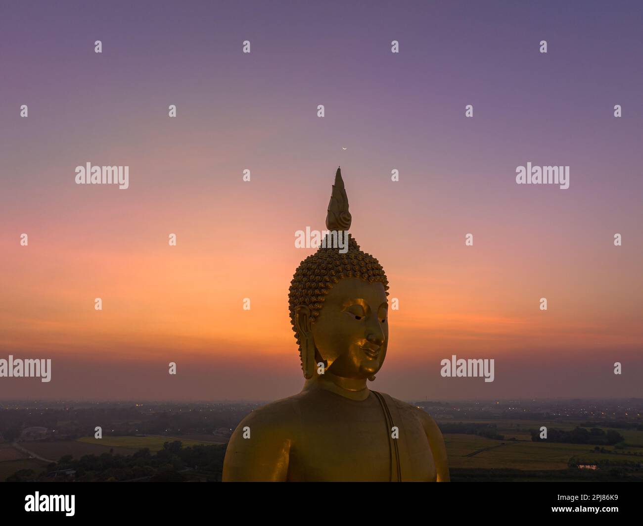 aerial view The moon was above the head of the biggest golden Buddha in ...