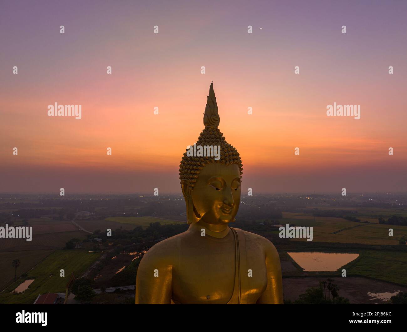 aerial view The moon was above the head of the biggest golden Buddha in ...