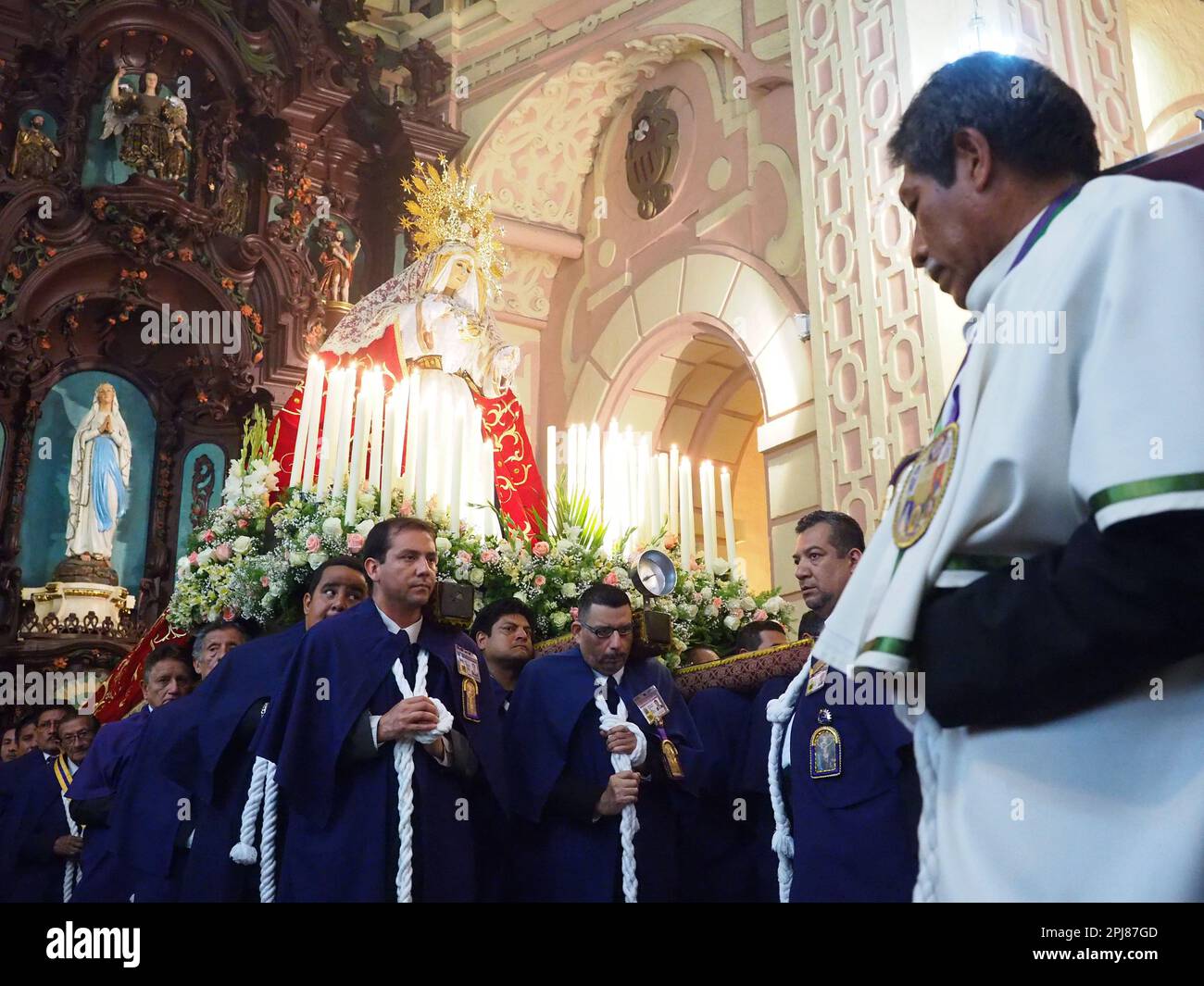 Devotees carrying a religious image leading the Friday of Sorrows ...