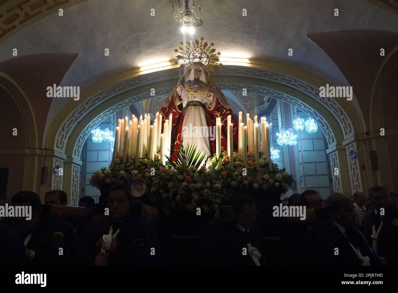 Devotees carrying a religious image leading the Friday of Sorrows ...