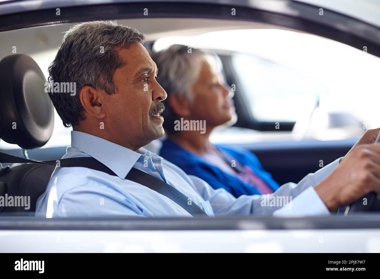 Safe and secure behind the wheel. a senior couple going for a drive ...