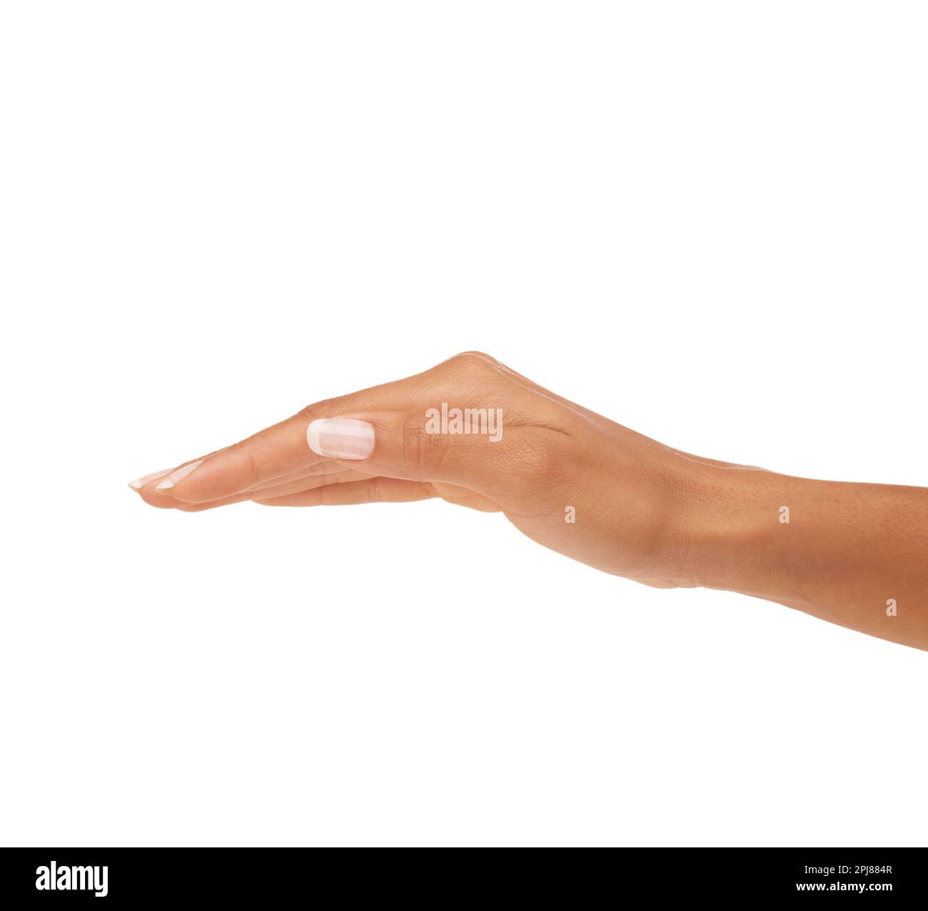 Smooth and feminine. A young womans hand isolated on a white background ...