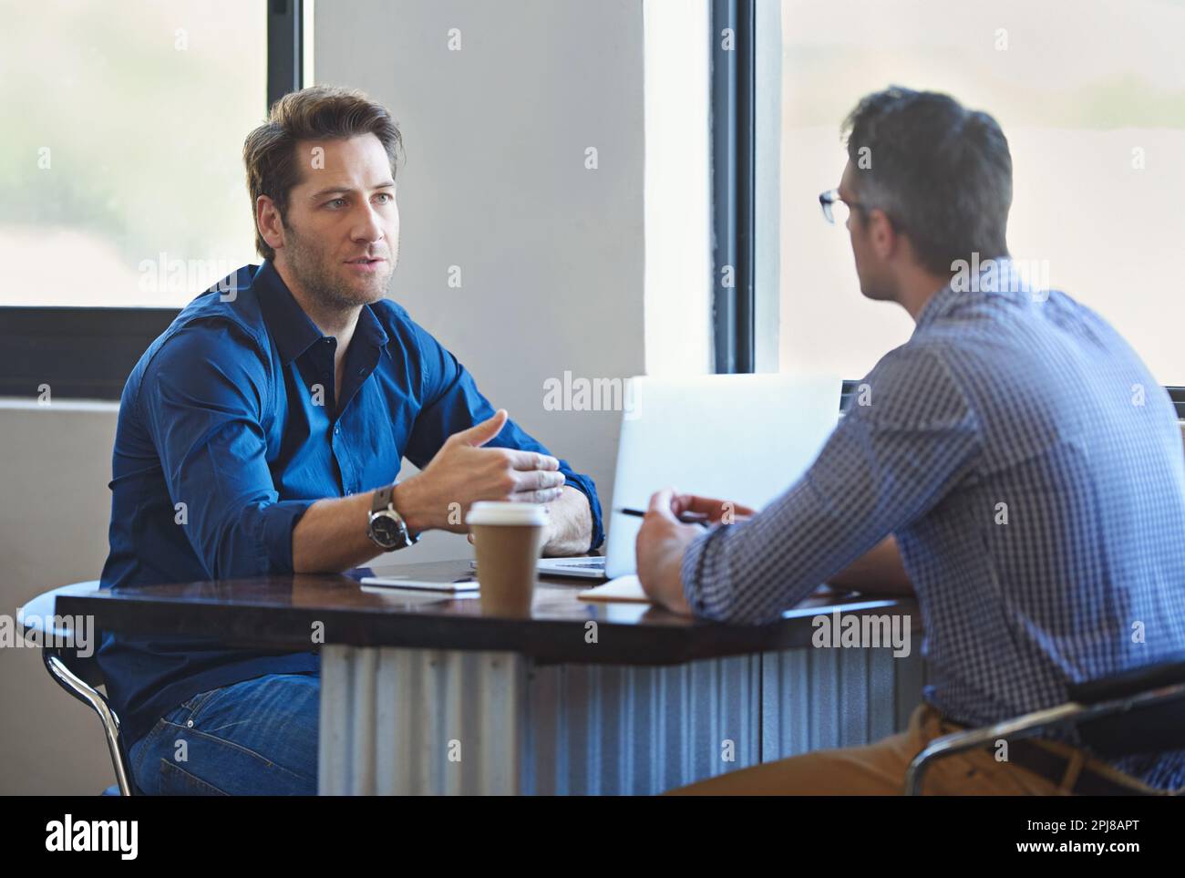 Two men talking over project hi-res stock photography and images - Alamy