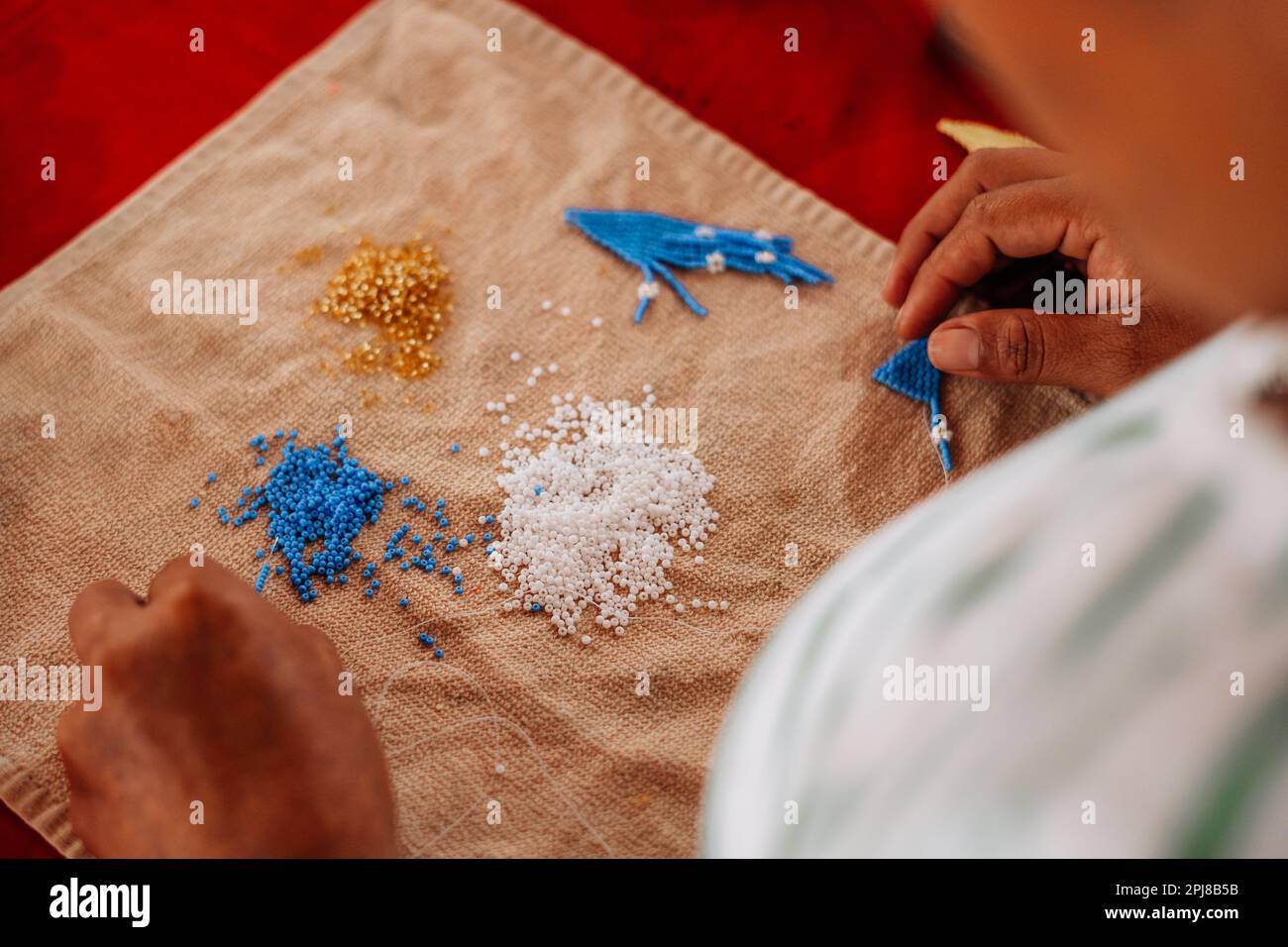 Embera Community of Medellin making Jewelry in Colombia Stock Photo - Alamy
