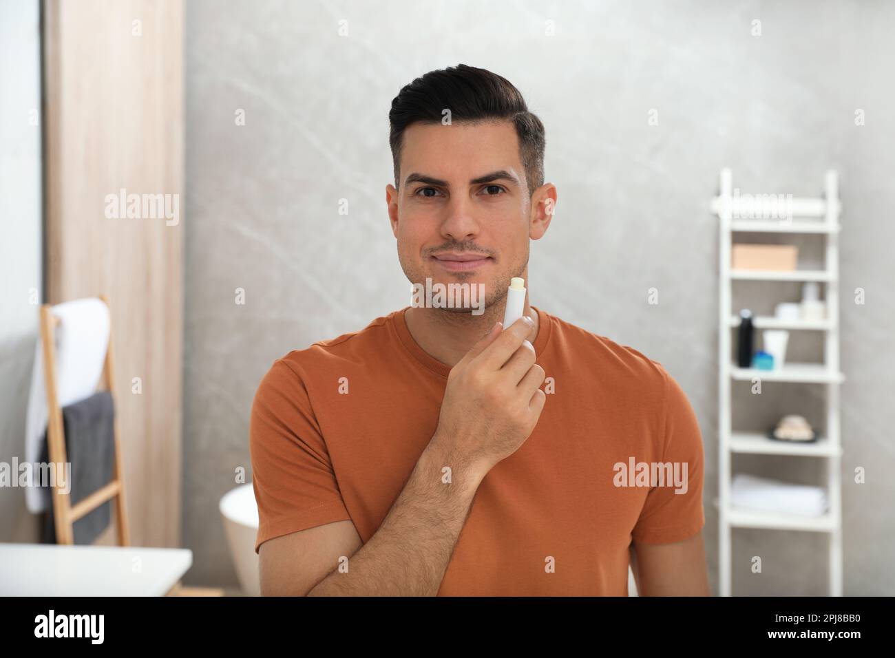 Man applying lipstick hi-res stock photography and images - Alamy