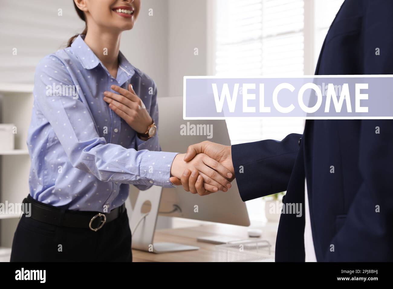 Welcome to team. Employee shaking hands with intern in office, closeup ...