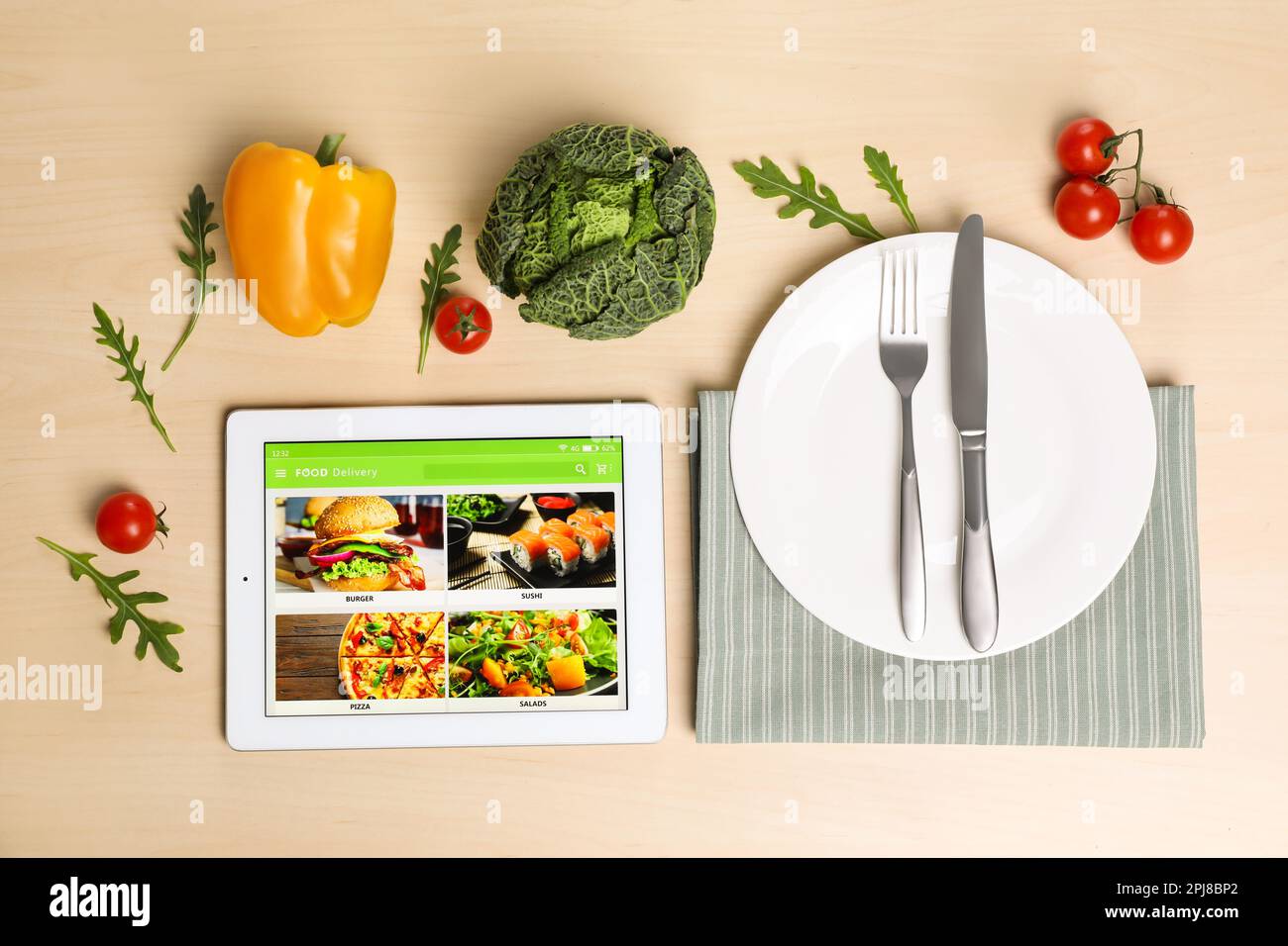 Modern tablet with open page for online food ordering, vegetables ...