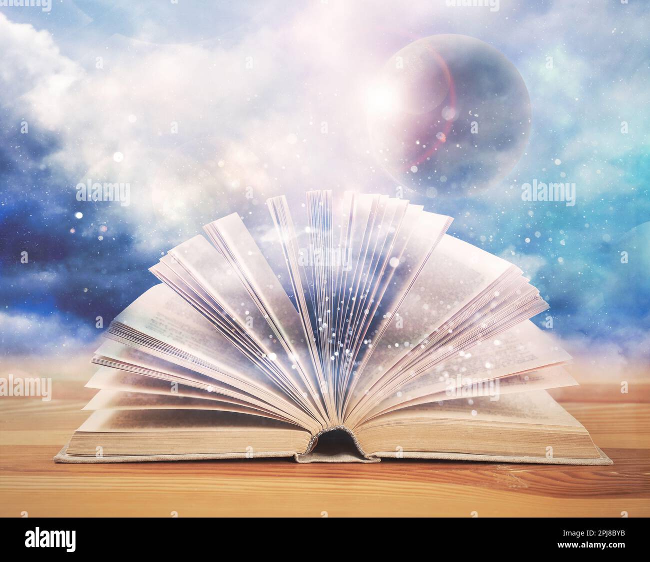 Open book with glitter overlay and beautiful sky on background Stock ...