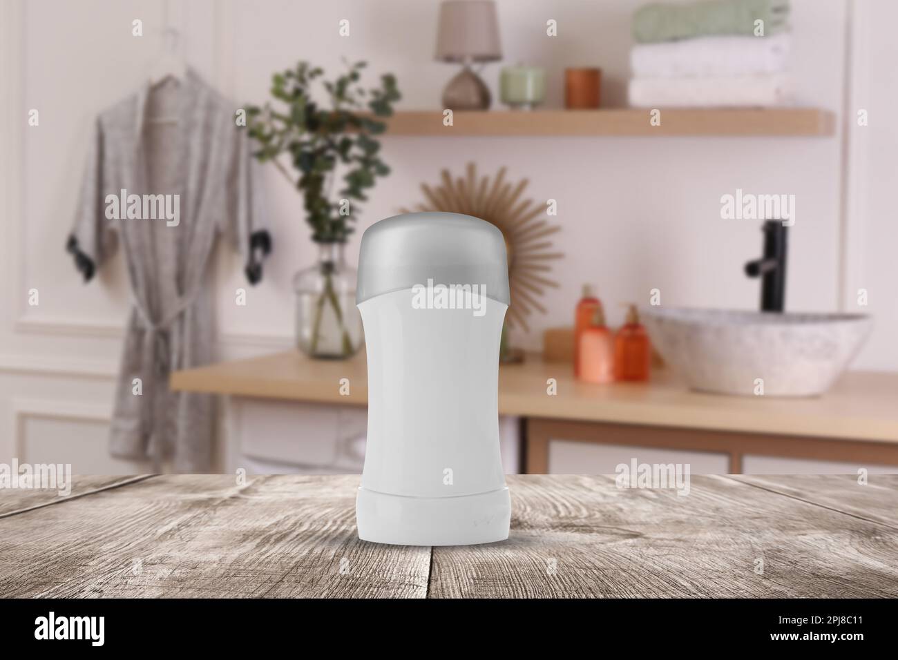 Solid deodorant on wooden table in bathroom. Mockup for design Stock ...
