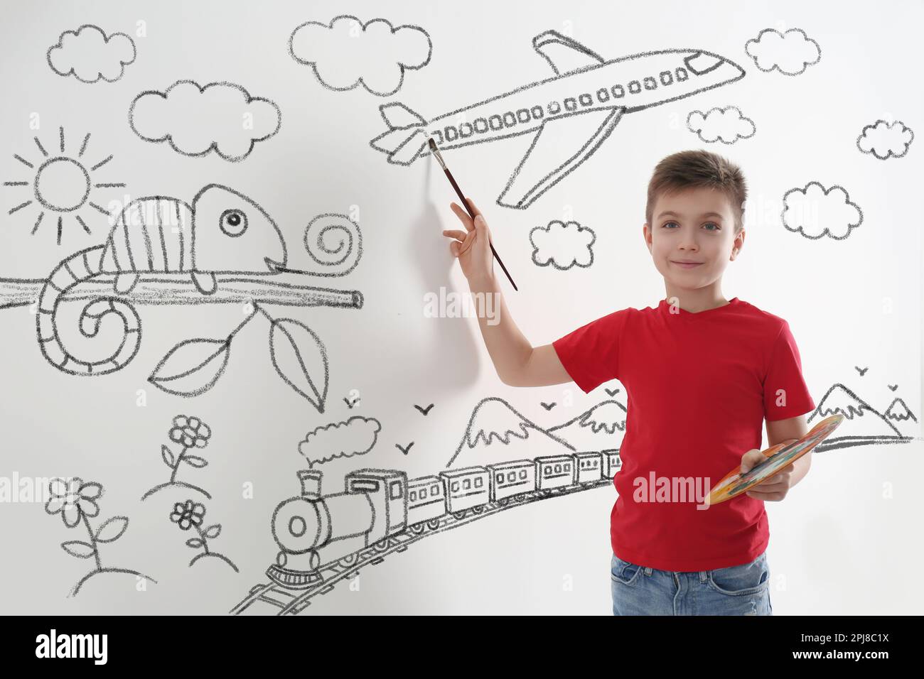 Cute little boy drawing on white background Stock Photo - Alamy