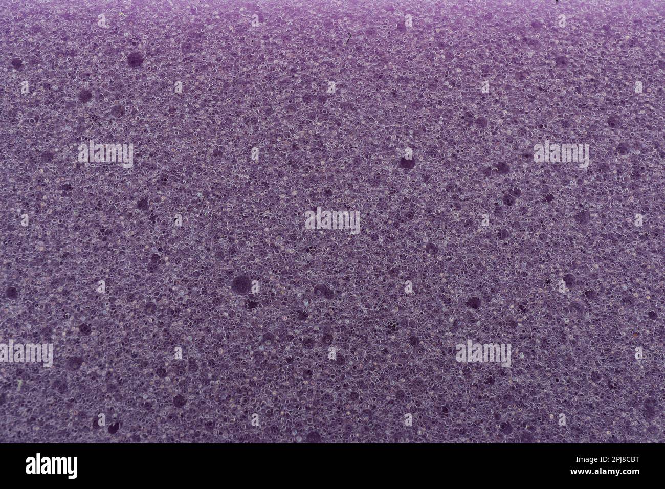 Purple cleaning sponge as background, top view Stock Photo - Alamy