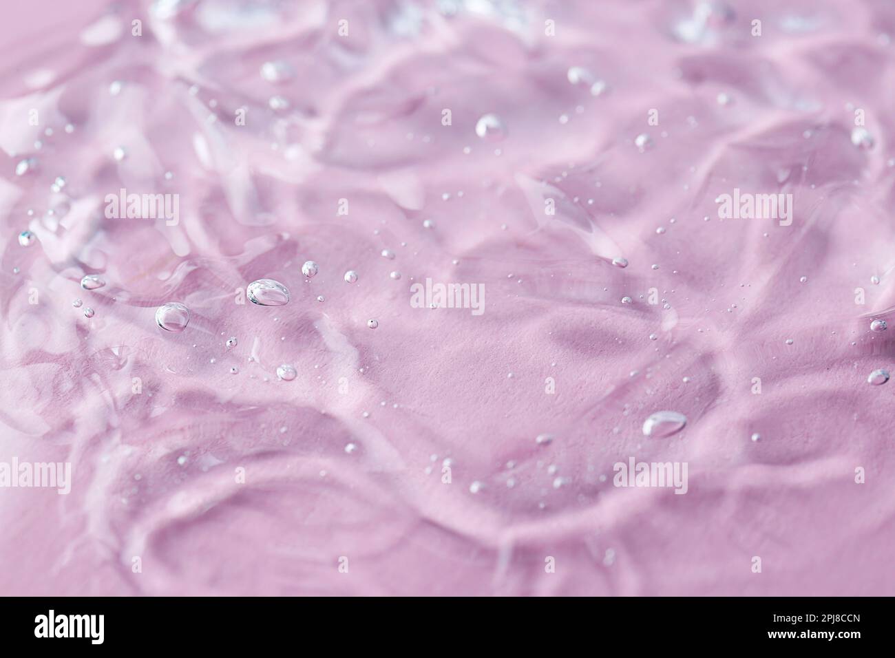 Texture of transparent shower gel on pink background, closeup Stock ...