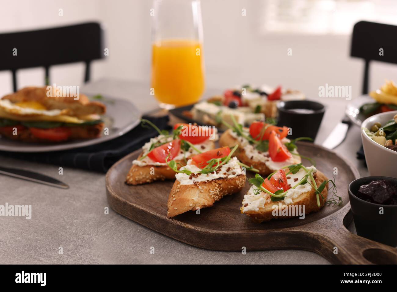 Delicious sandwiches with cheese and tomatoes served on buffet table ...