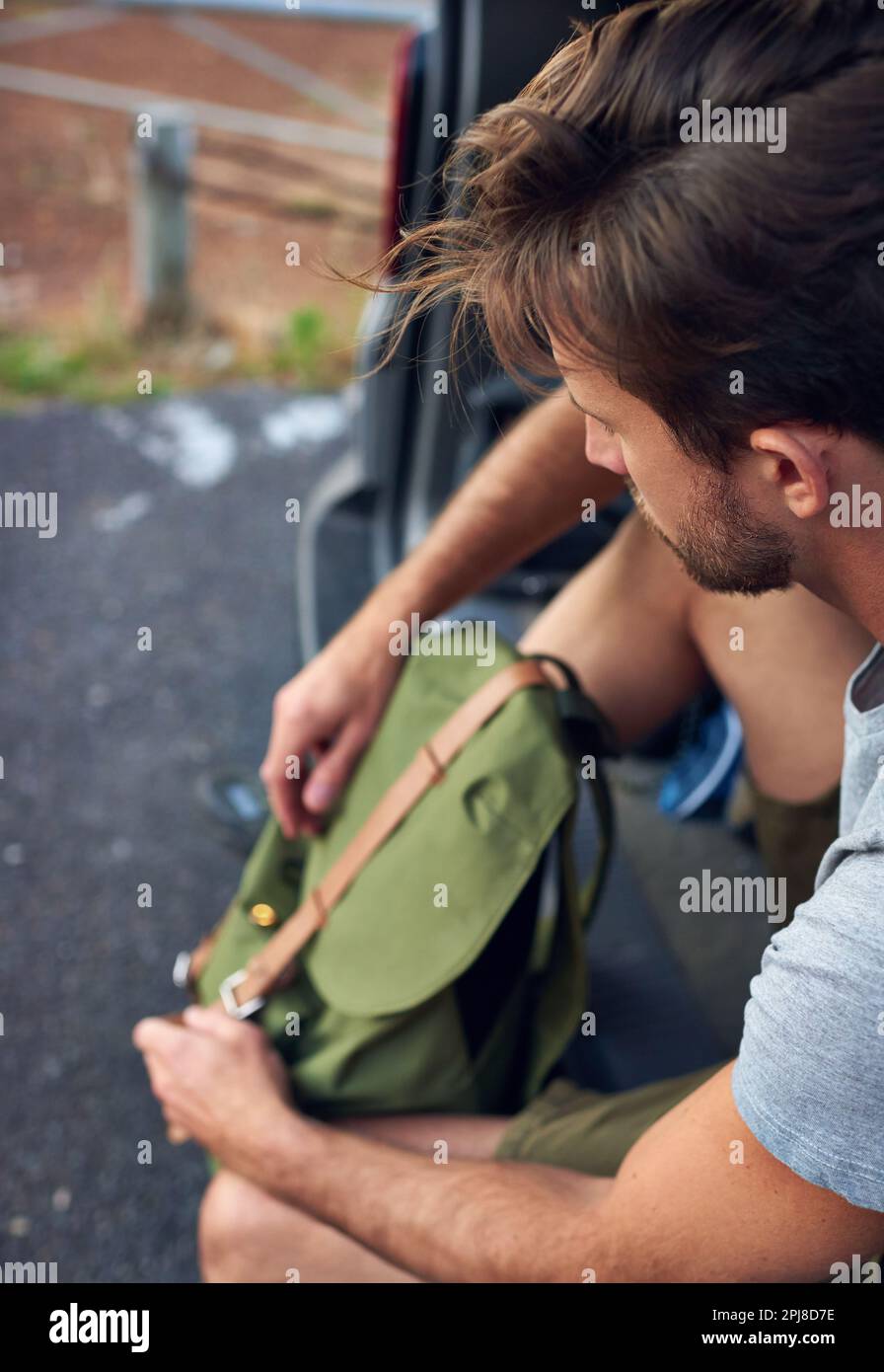 Getting ready to explore unknown terrains. a man sitting in the back of ...