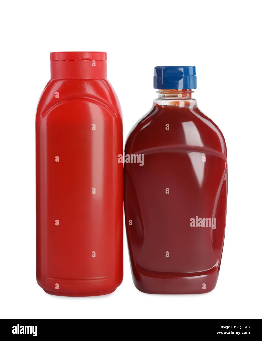 Different bottles of ketchup on white background Stock Photo - Alamy