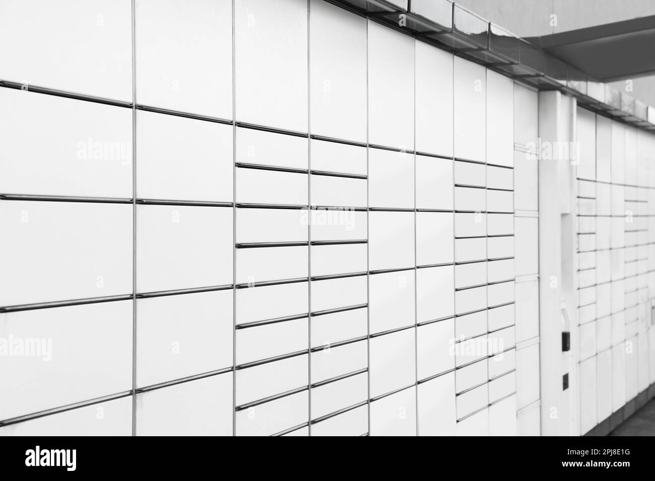 Modern parcel locker with many postal boxes Stock Photo - Alamy