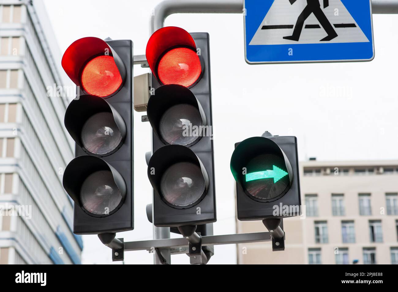 Traffic lights and Pedestrian Crossing road sign in city Stock Photo ...