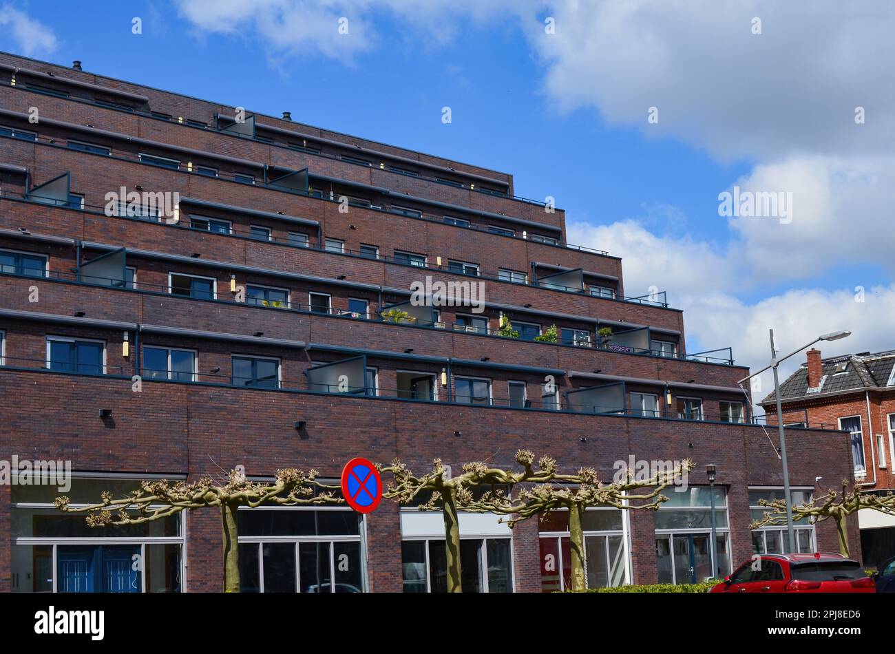 Exterior of beautiful red brick apartment building on sunny day Stock ...