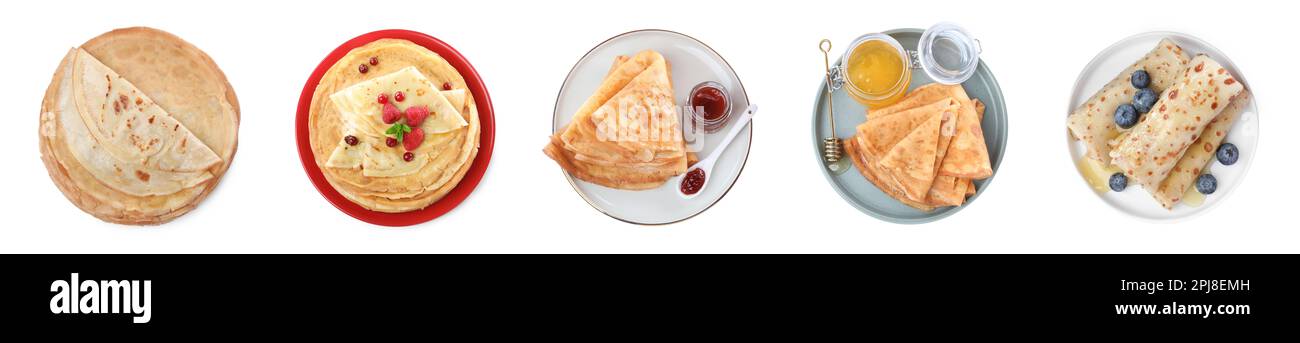 Set of delicious crepes with berries, jam and honey on white background ...
