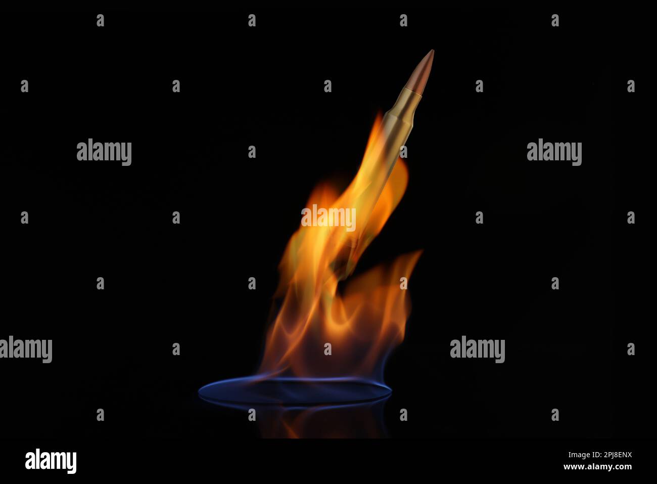 Bullet with flames flying on black background Stock Photo - Alamy