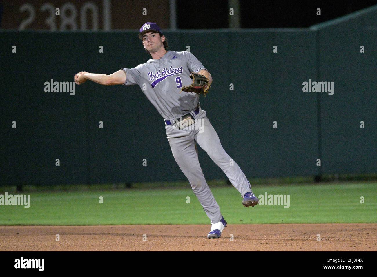 North Alabama third baseman Jackson Ferrigno (9) throws to first base ...