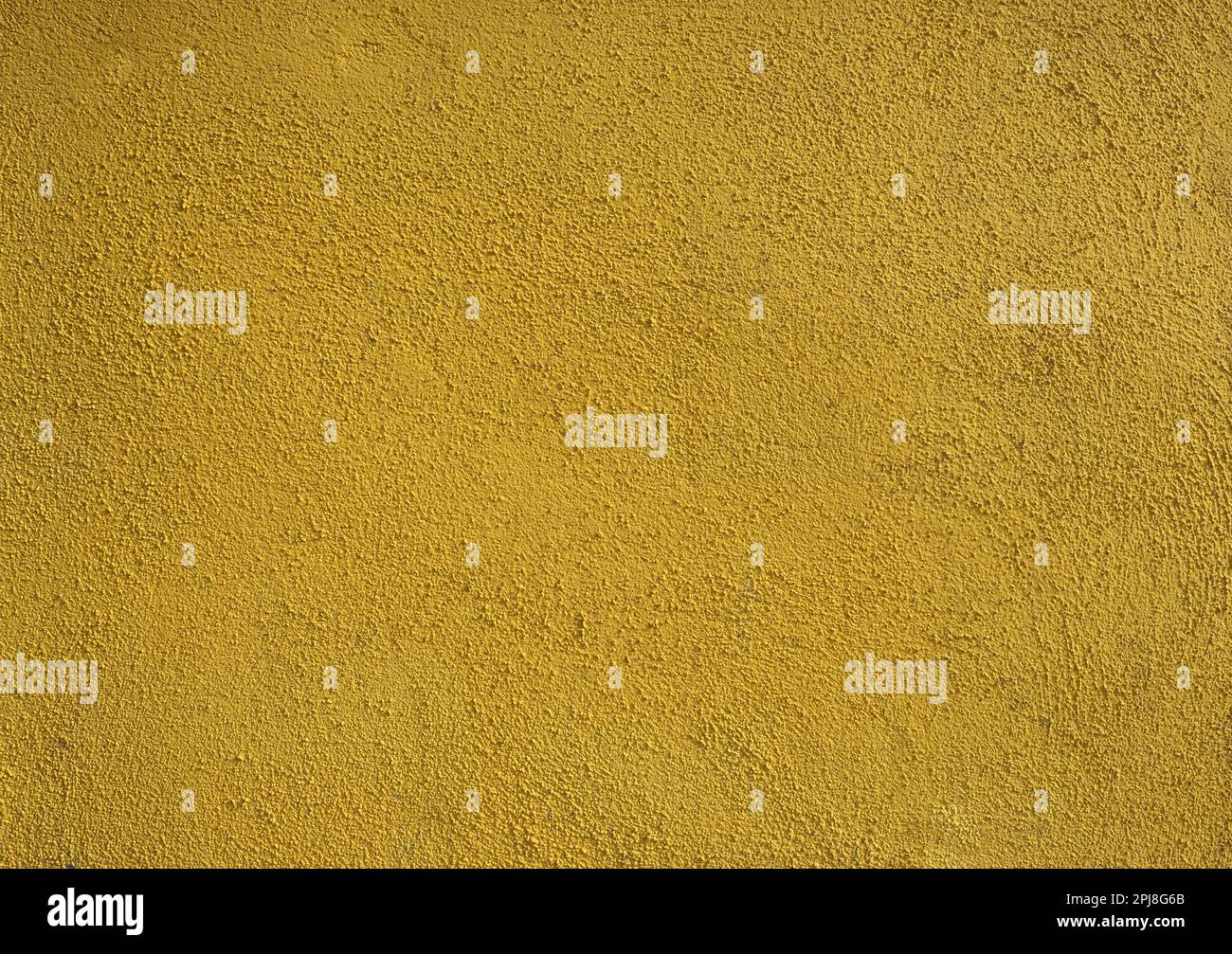 yellow plaster wall useful as a background Stock Photo - Alamy