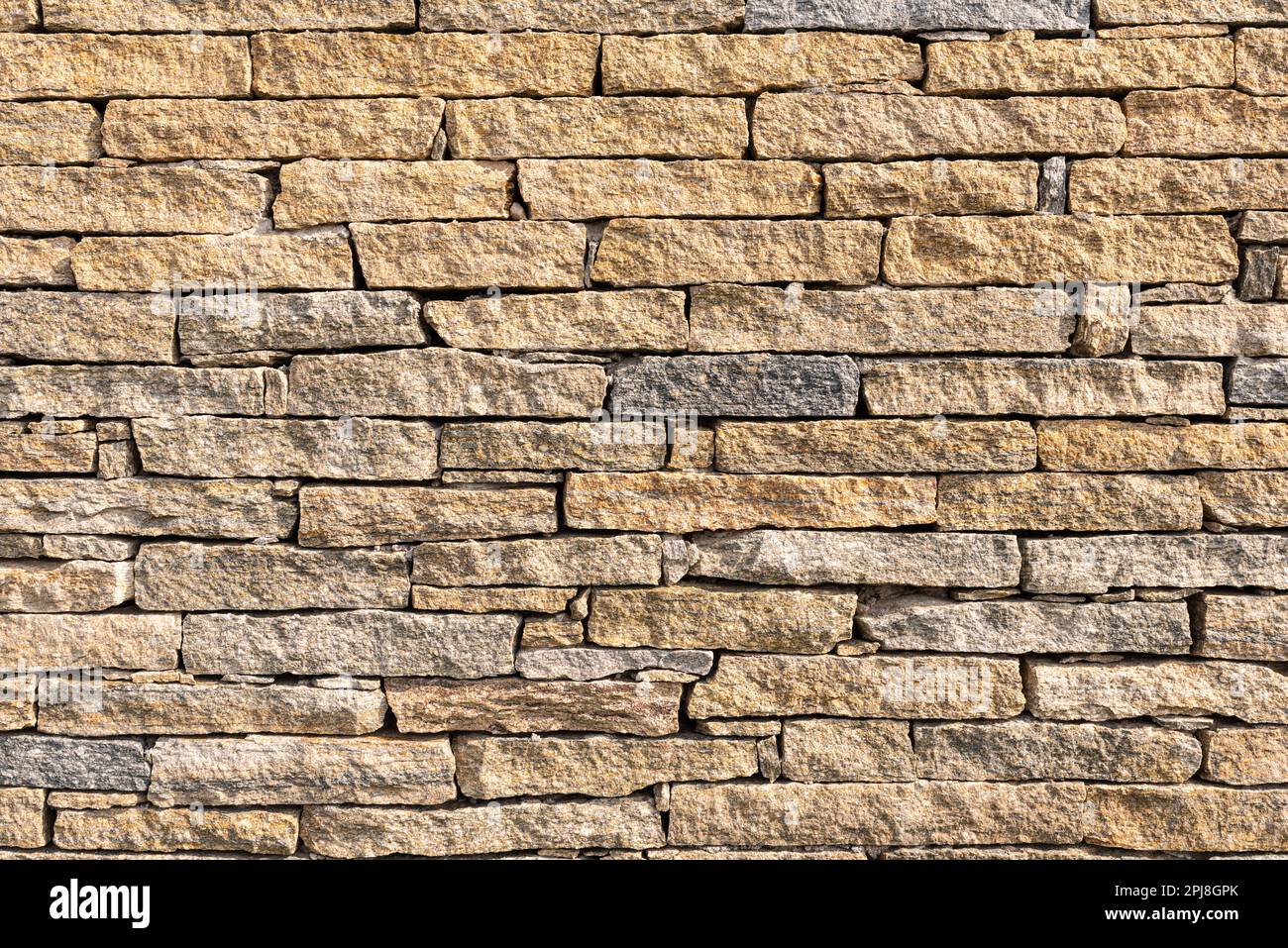 Yellow stone brick wall pattern suitable as wallpaper Stock Photo - Alamy