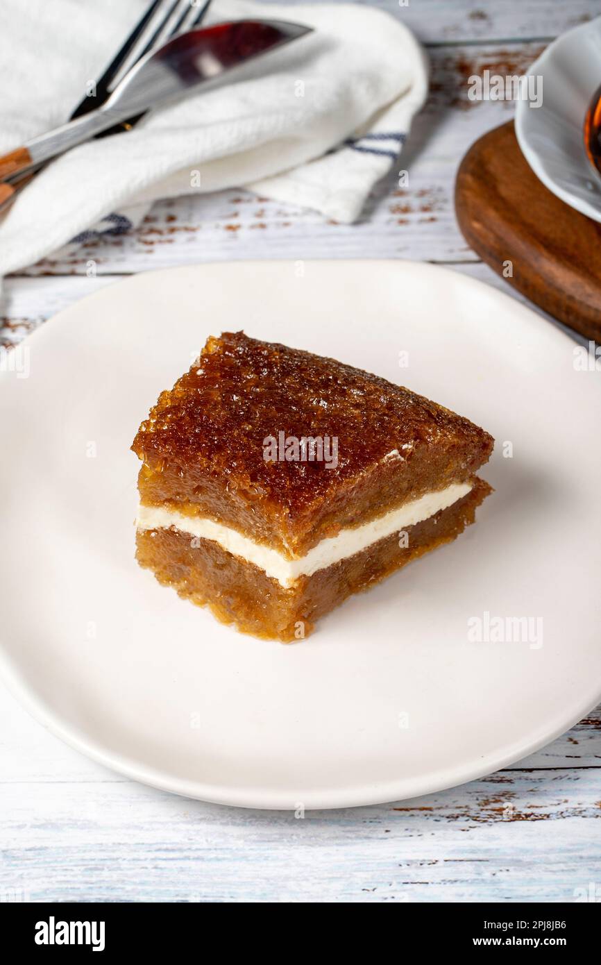 Bread pudding on wood floor. Traditional Ramadan dessert. Bread kadayif ...