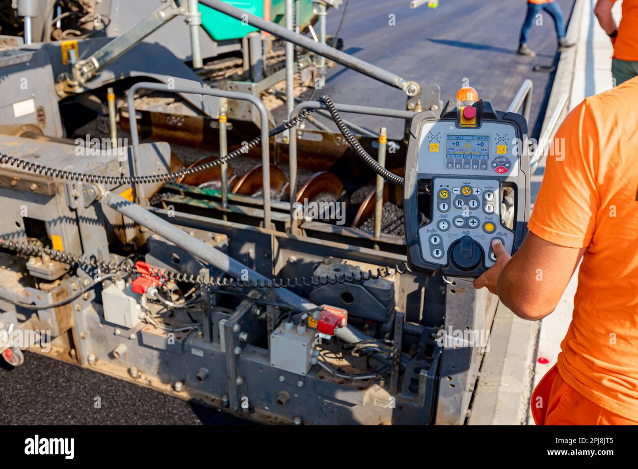 Operator, worker is holding industrial remote control, console with ...