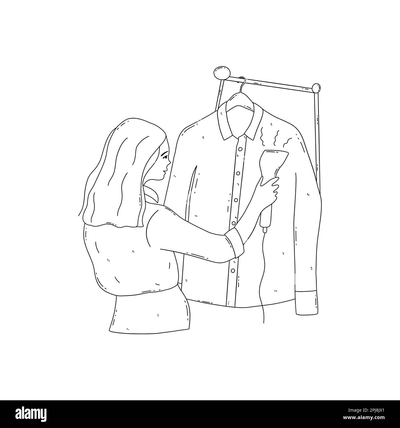 Girl is ironing clean shirt with hand steamer. Portable iron with ...