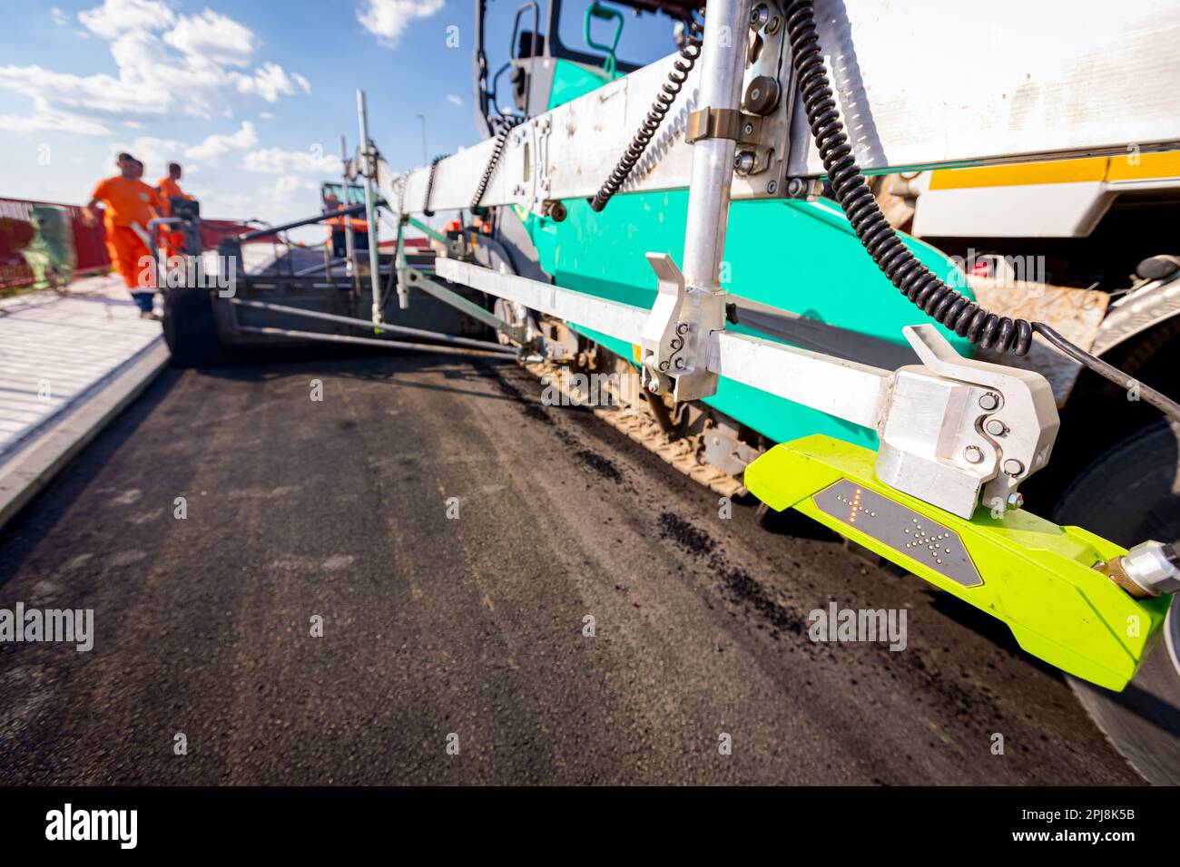 Road laying construction machine with ultrasonic grade, slope, non ...