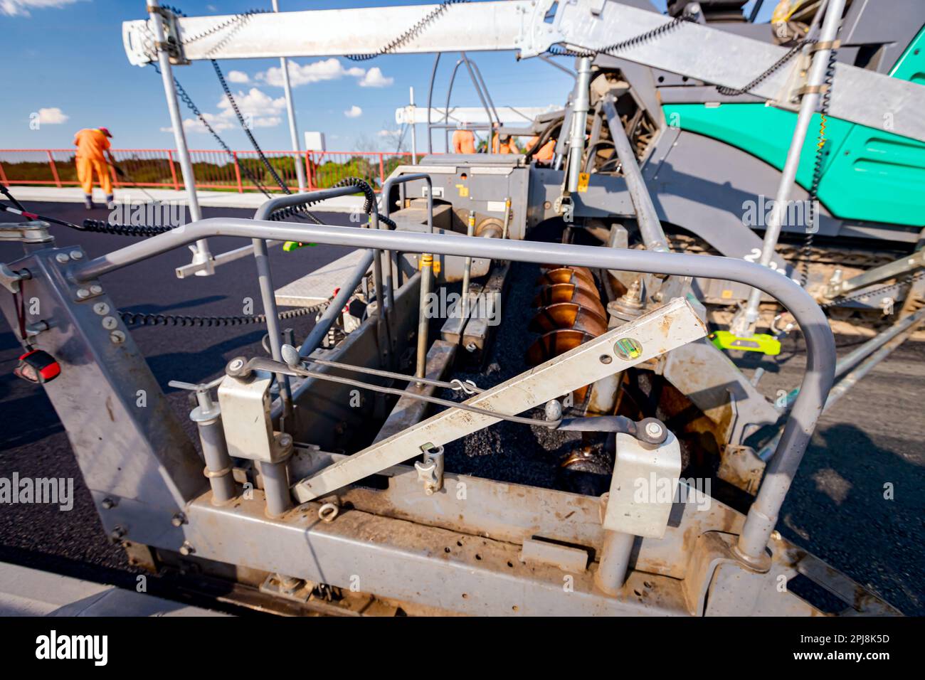 Spirit level for control measurements placed on the machine for laying ...