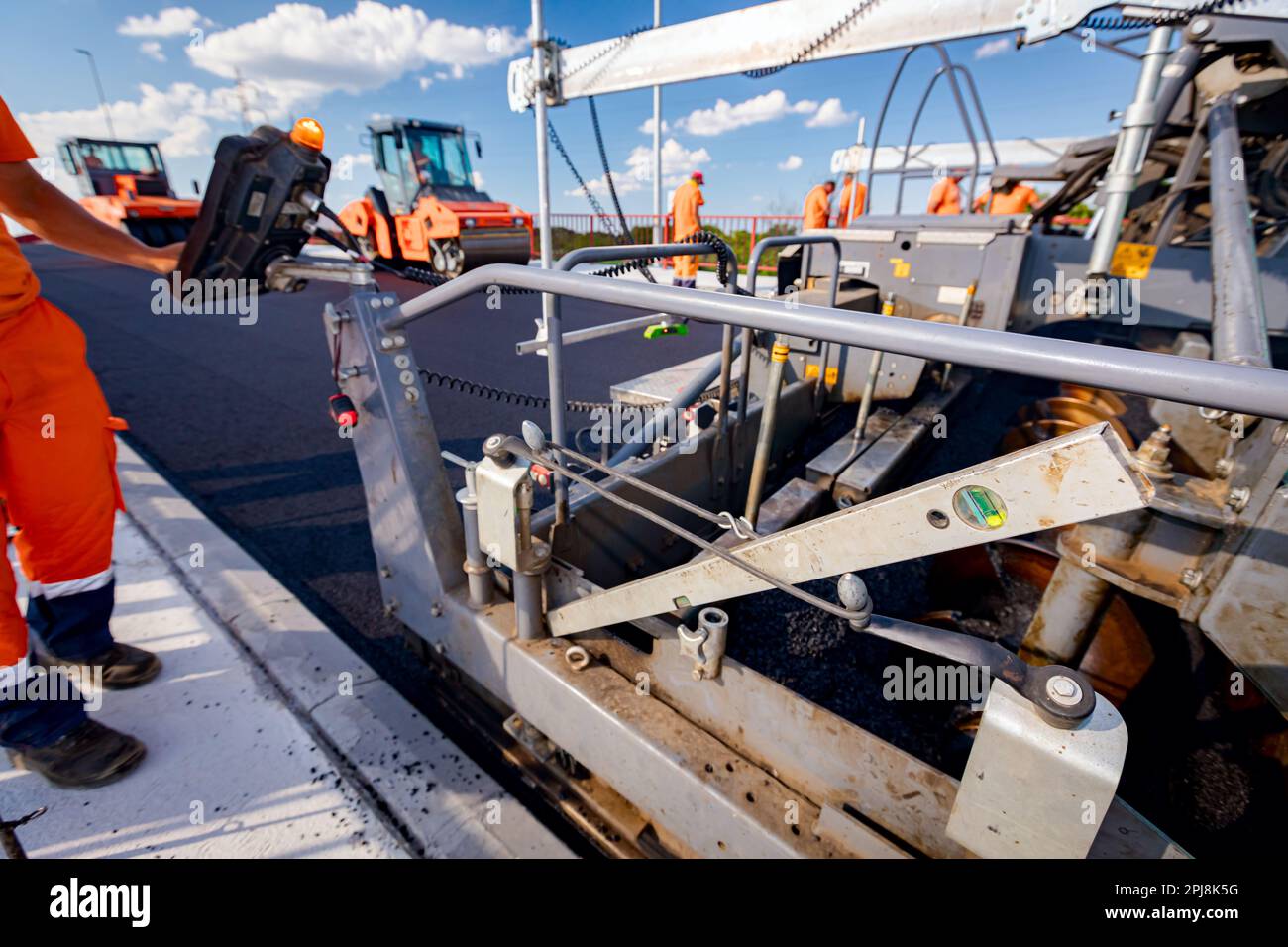 Spirit level for control measurements placed on the machine for laying ...
