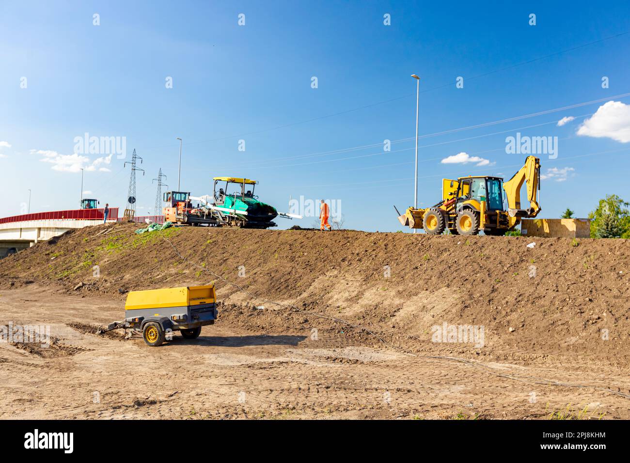 Spreader machine lays, pours hot asphalt, laying asphalt. Pneumatic ...