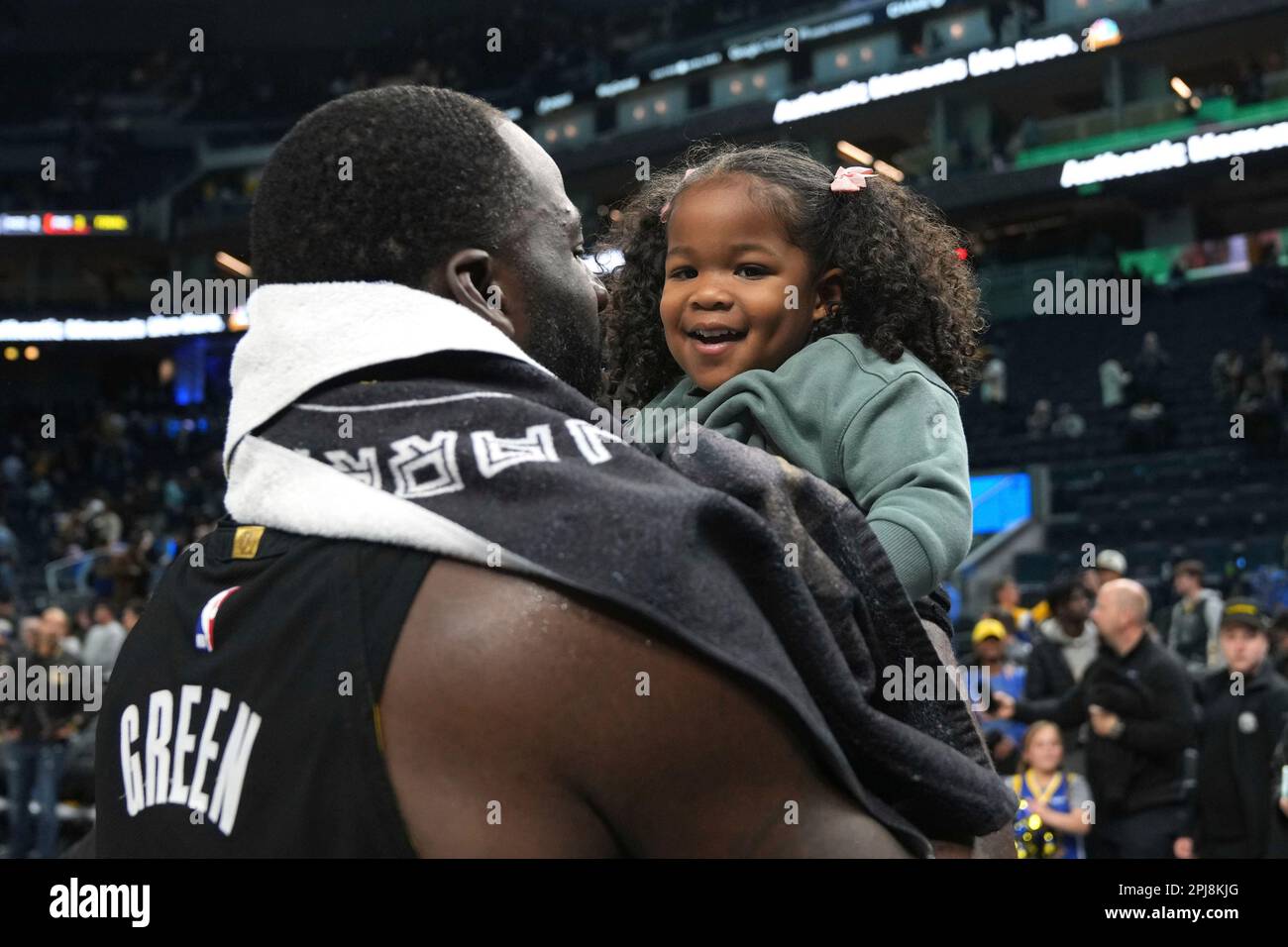 Golden State Warriors forward Draymond Green, left, carries daughter ...