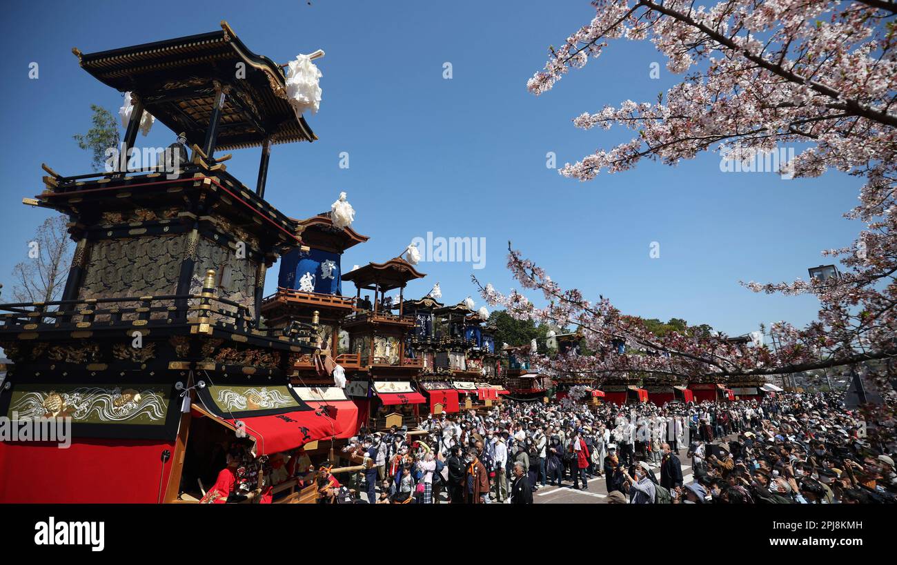 A procession of three leveled "dashi", the traditional wheeled floats ...