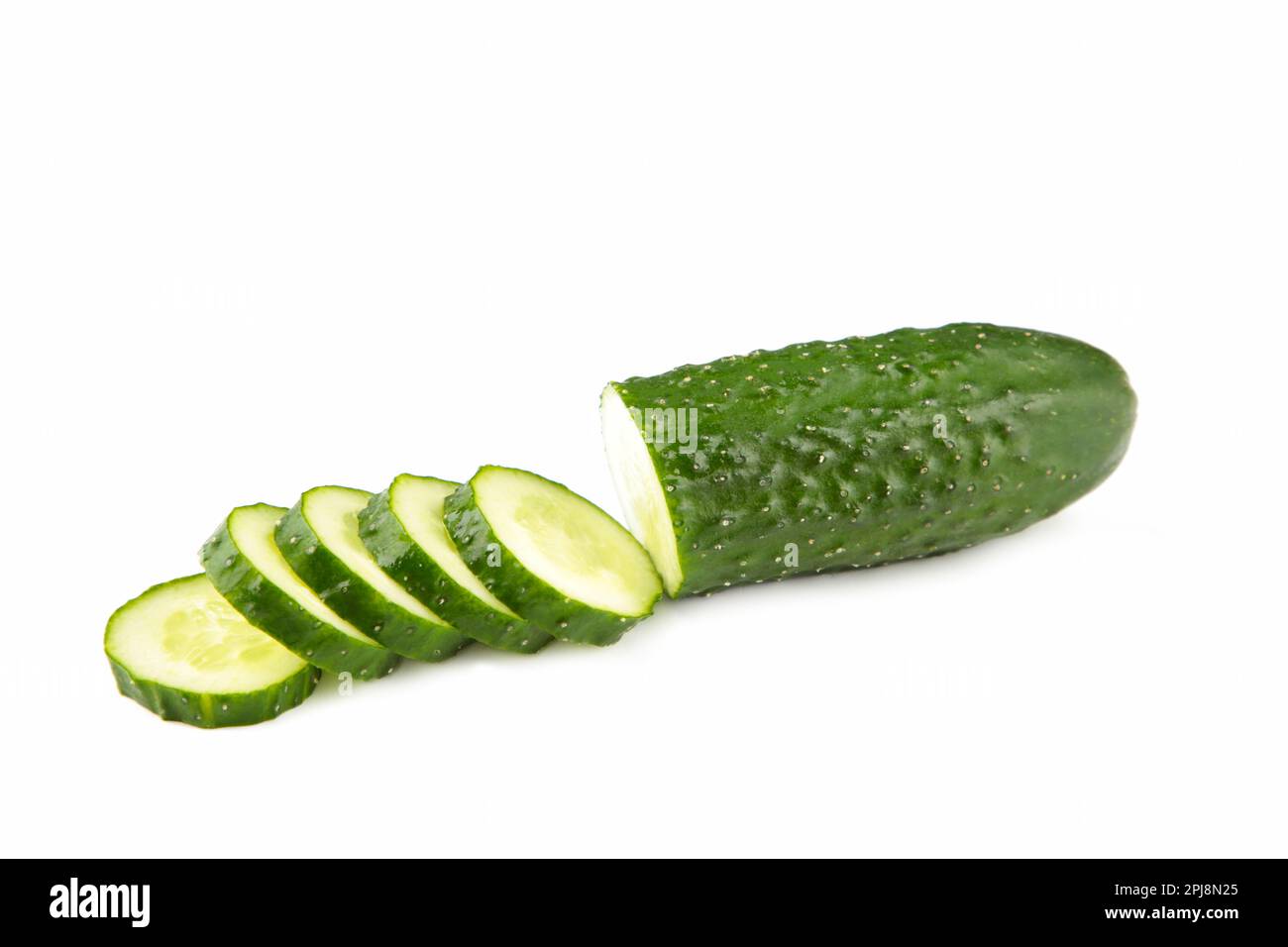Cucumber and slices isolated over white background. Top view Stock ...