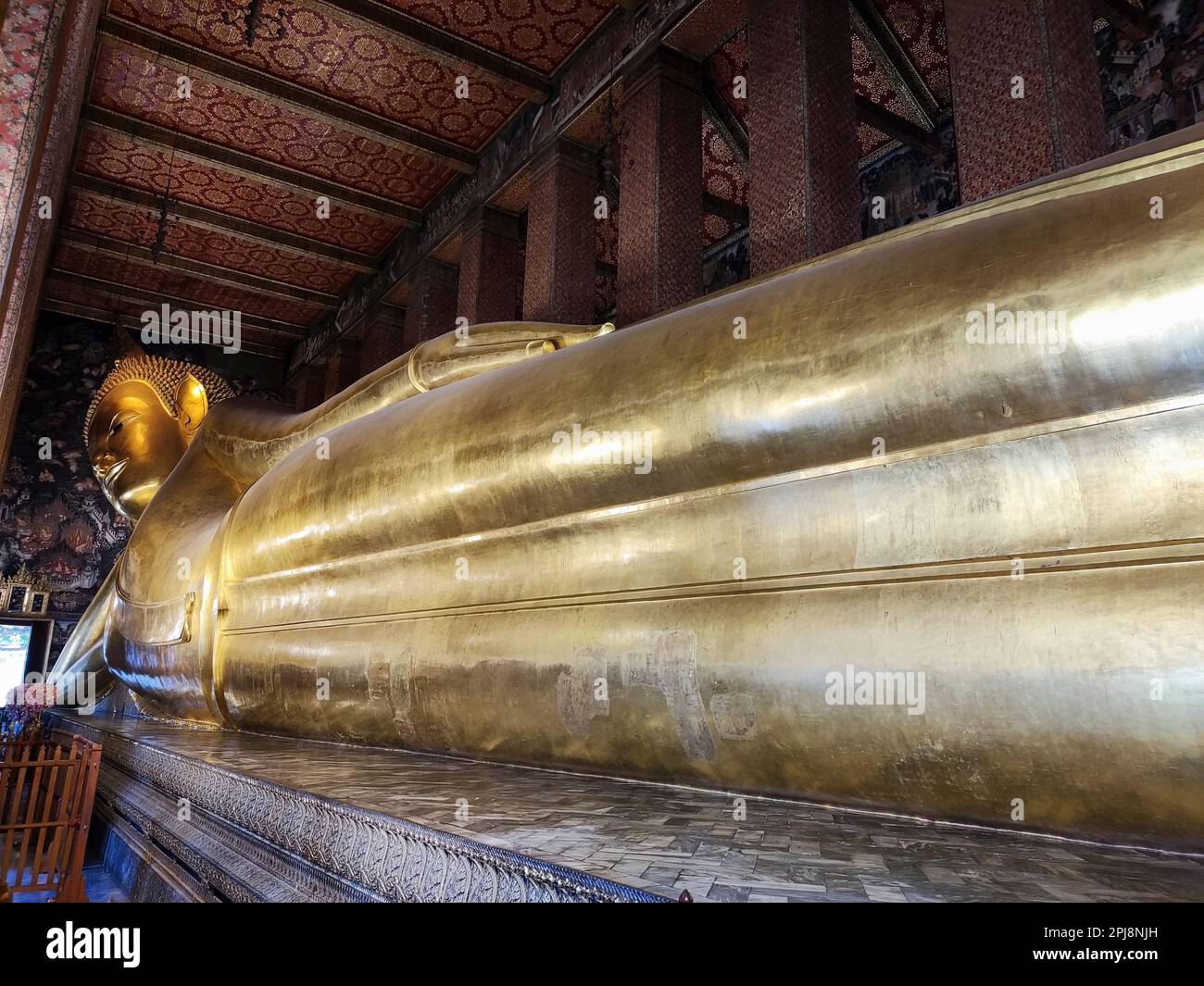 Gigantic Reclining Buddha statue in Wat Pho, Bangkok. Wat Pho is the oldest and largest temple ...