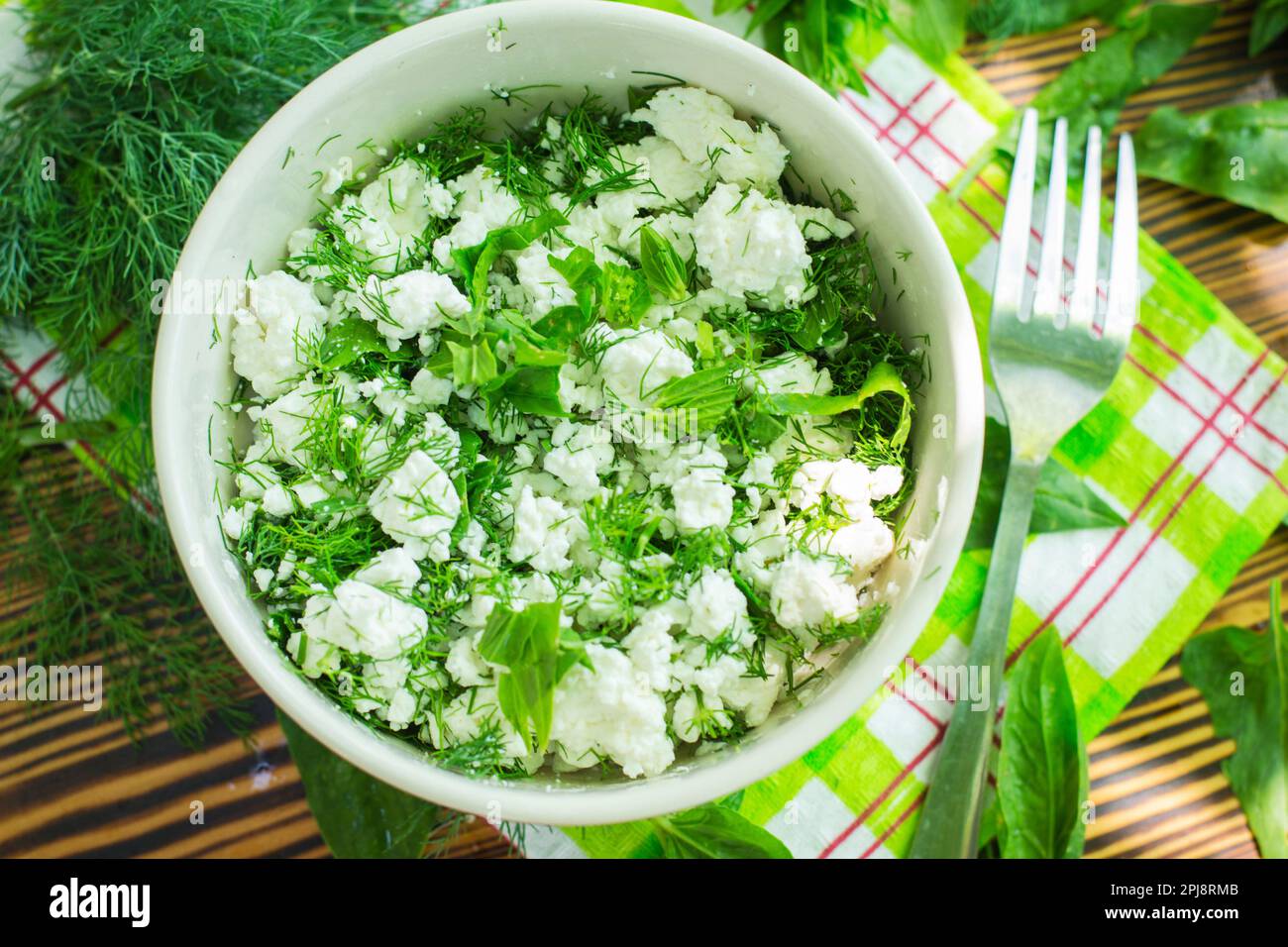 Fresh cottage cheese with spinach and herbs. Diet food Stock Photo - Alamy