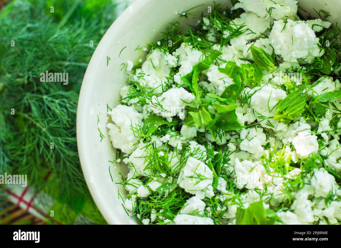 Fresh cottage cheese with spinach and herbs. Diet food Stock Photo - Alamy
