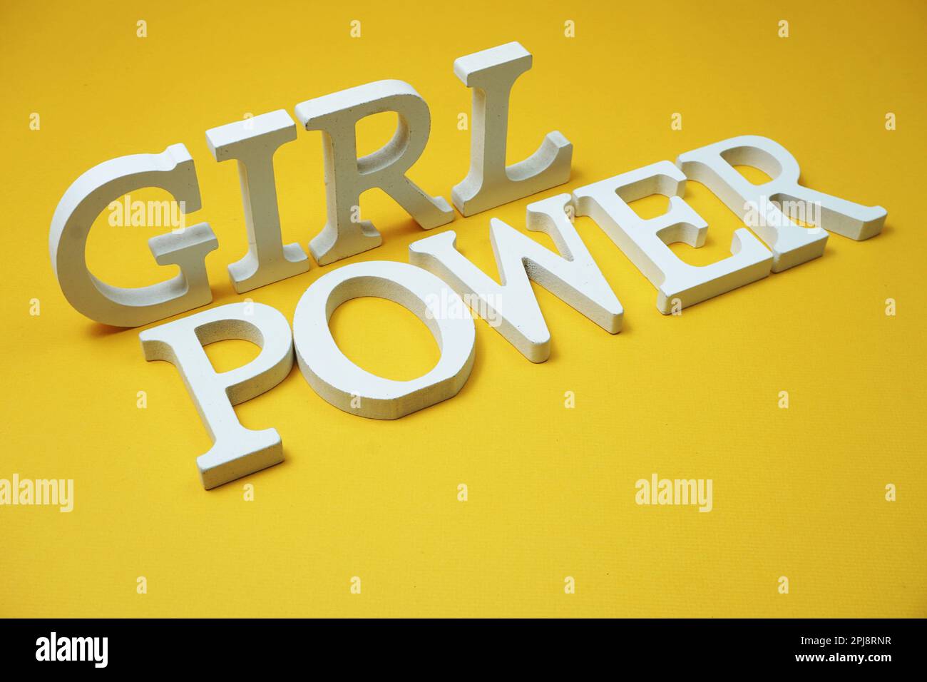 Girl Power alphabet letters on yellow background Stock Photo - Alamy