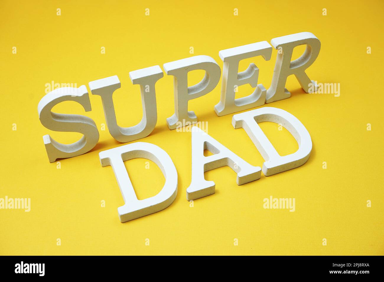 Super Dad alphabet letters on yellow background Stock Photo - Alamy
