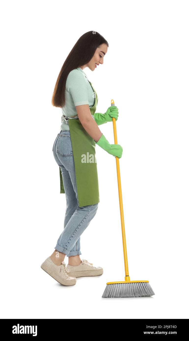 Beautiful young woman with broom on white background Stock Photo - Alamy