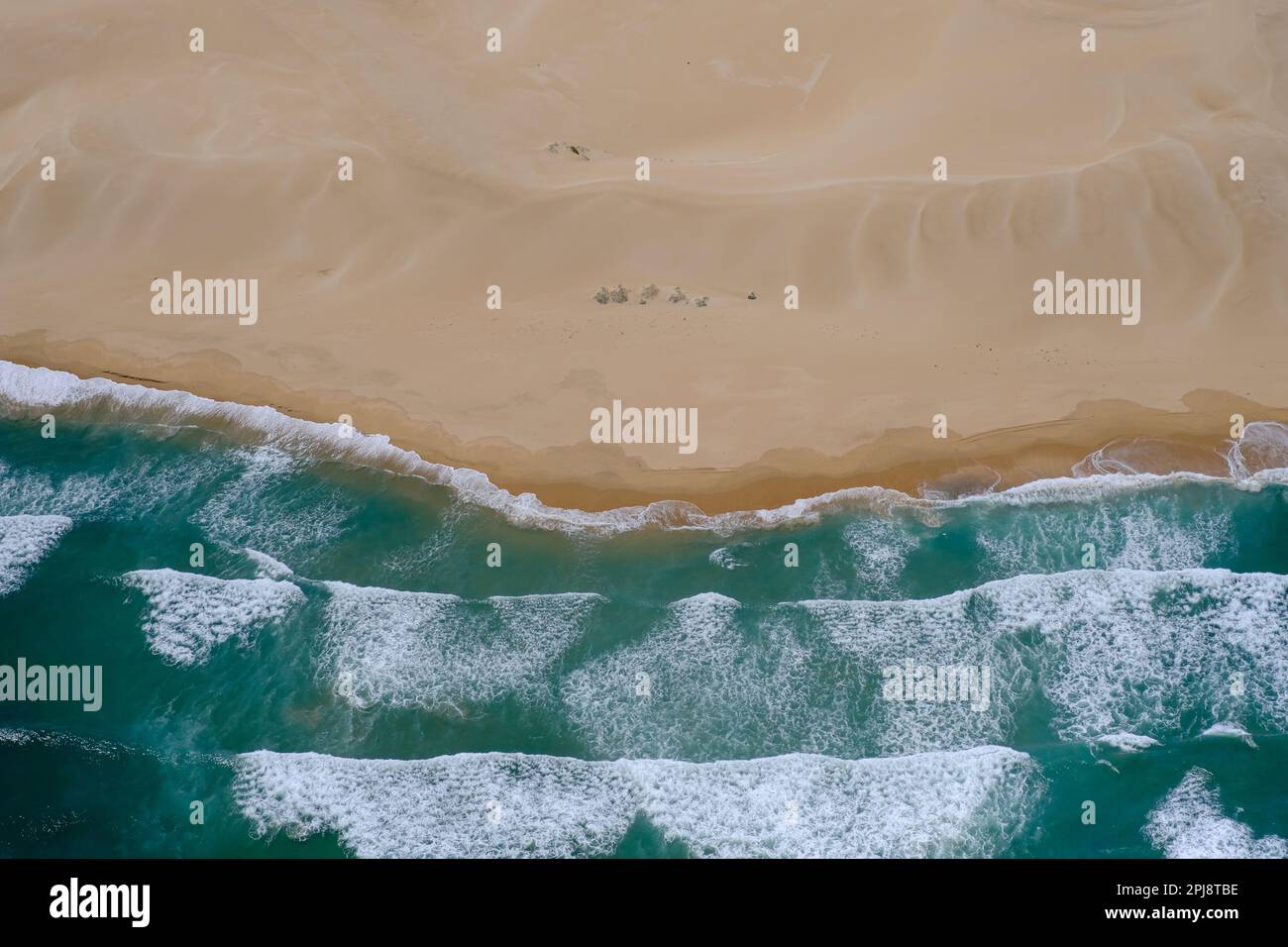 Aerial view of a remote stretch of beach between Woody Cape and ...