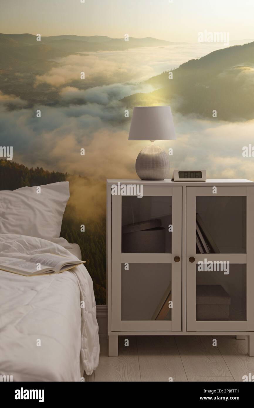 Beautiful wallpaper with mountain landscape in bedroom interior Stock ...