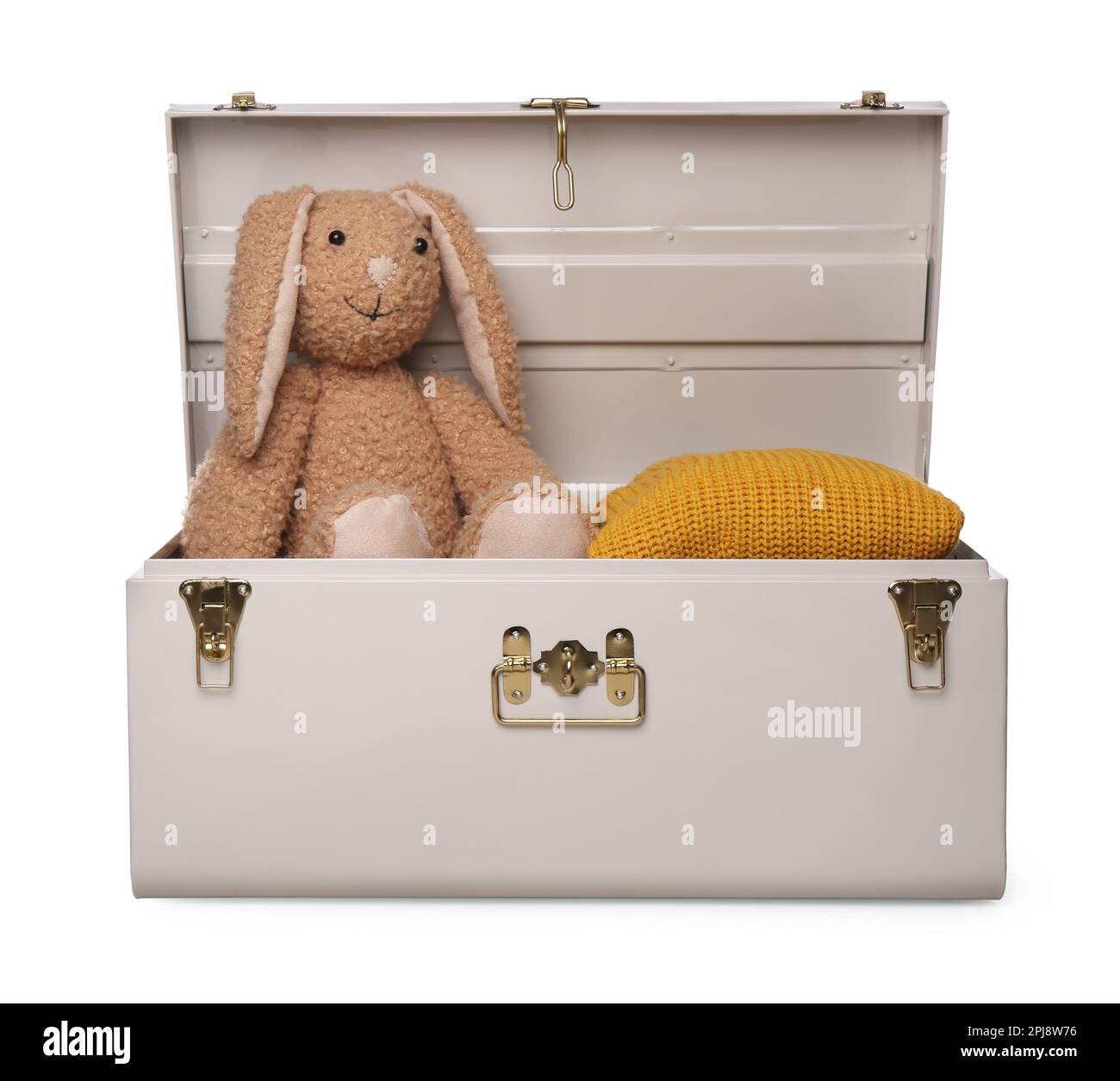 Stylish storage trunk with clothes and toy bunny isolated on white ...