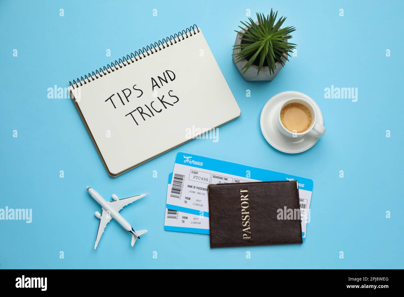 Flat lay composition with notebook on light blue background. Tips and ...