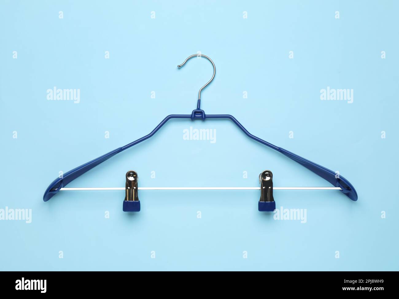 Empty hanger on light blue background, top view Stock Photo - Alamy