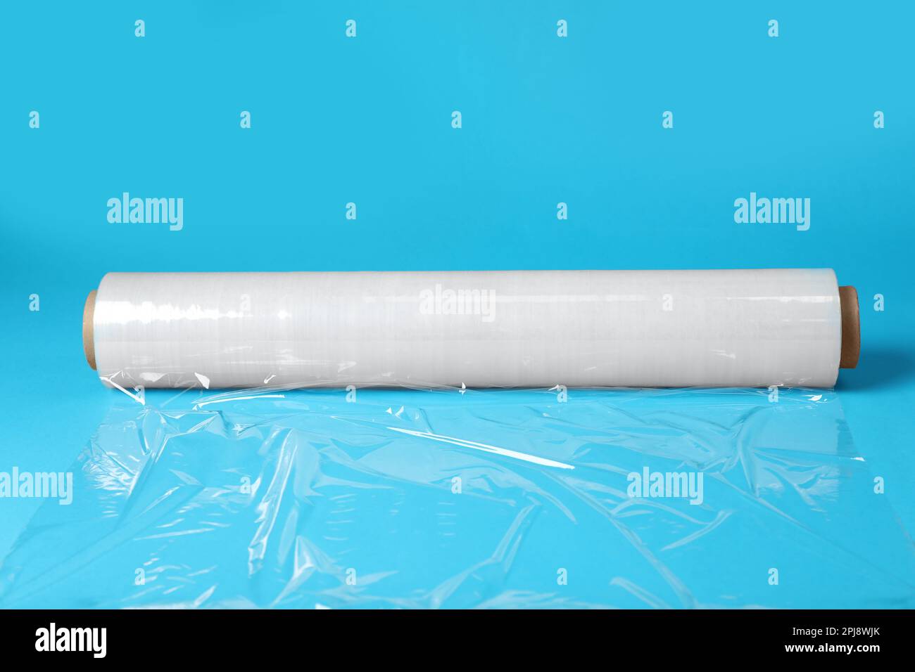 Roll of transparent stretch wrap on turquoise background Stock Photo ...