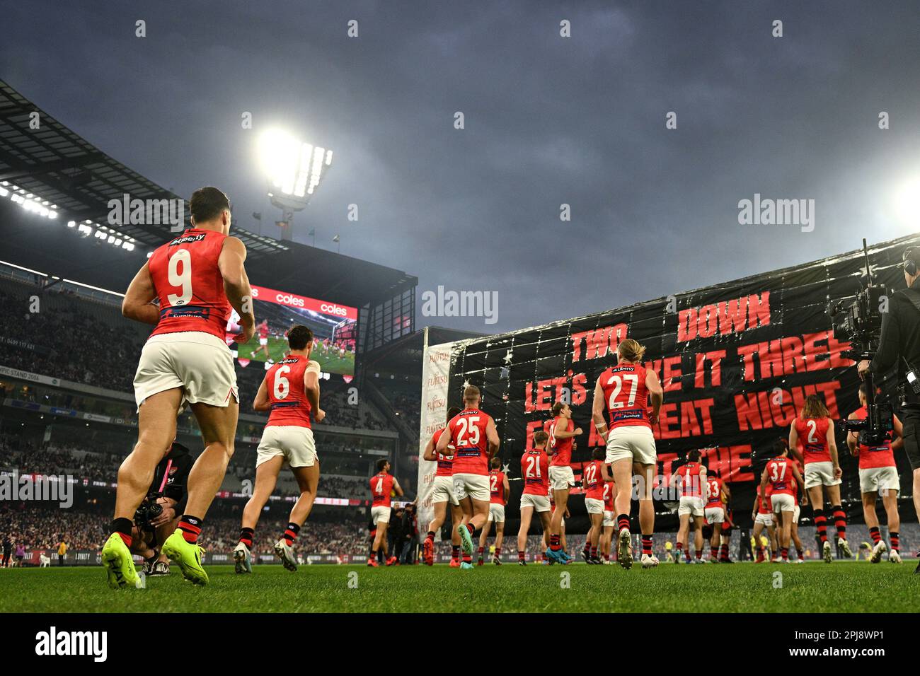 Essendon players take to the field during the AFL Round 3 match between ...